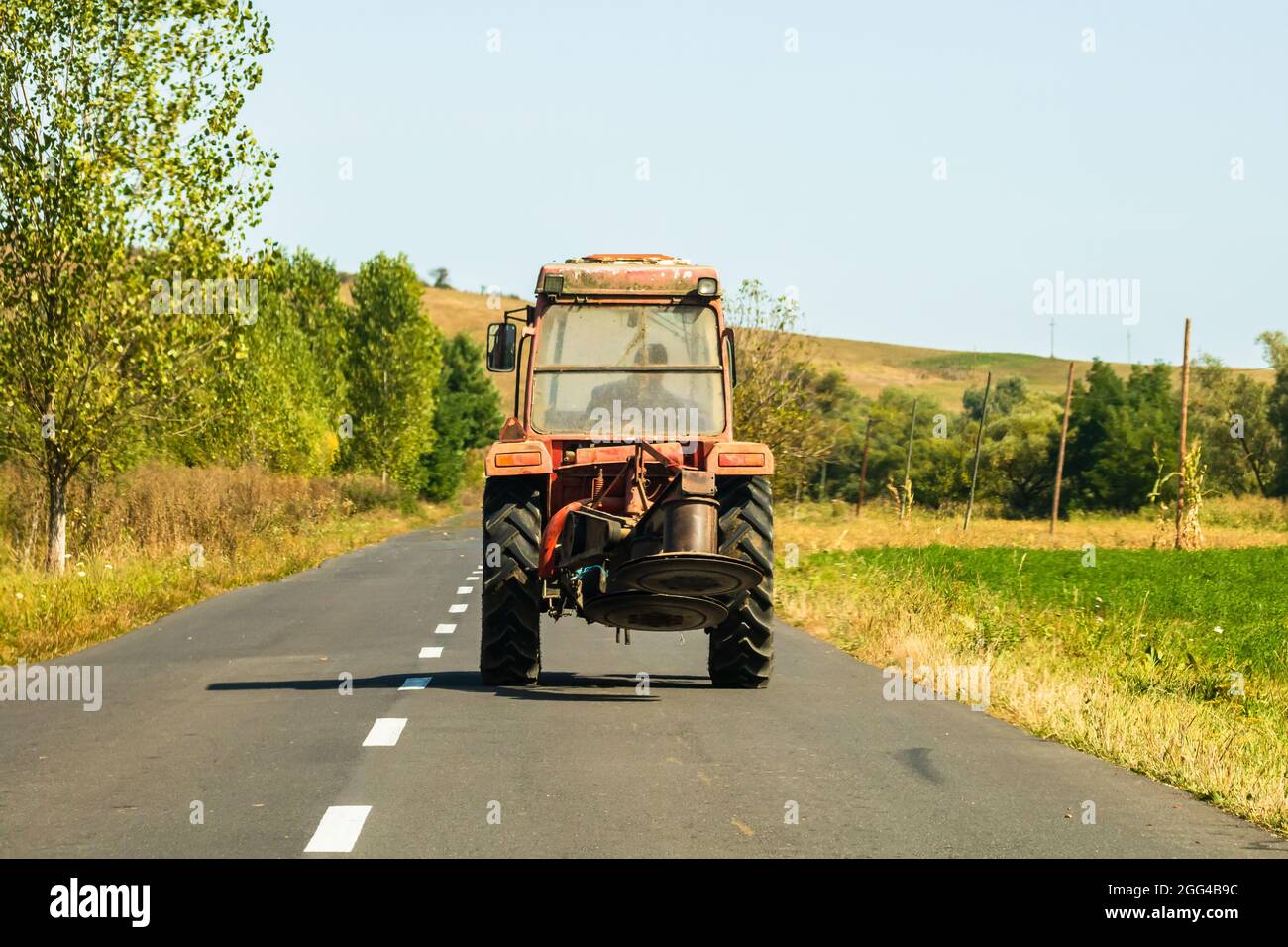 Agricultural tractor on road in Viscri, Romania, 2021 Stock Photo - Alamy