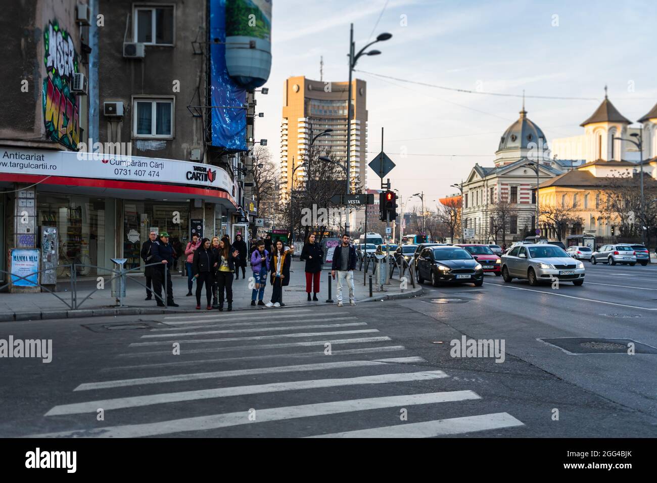 People walking or crossing the street in downtown Bucharest, Romania ...