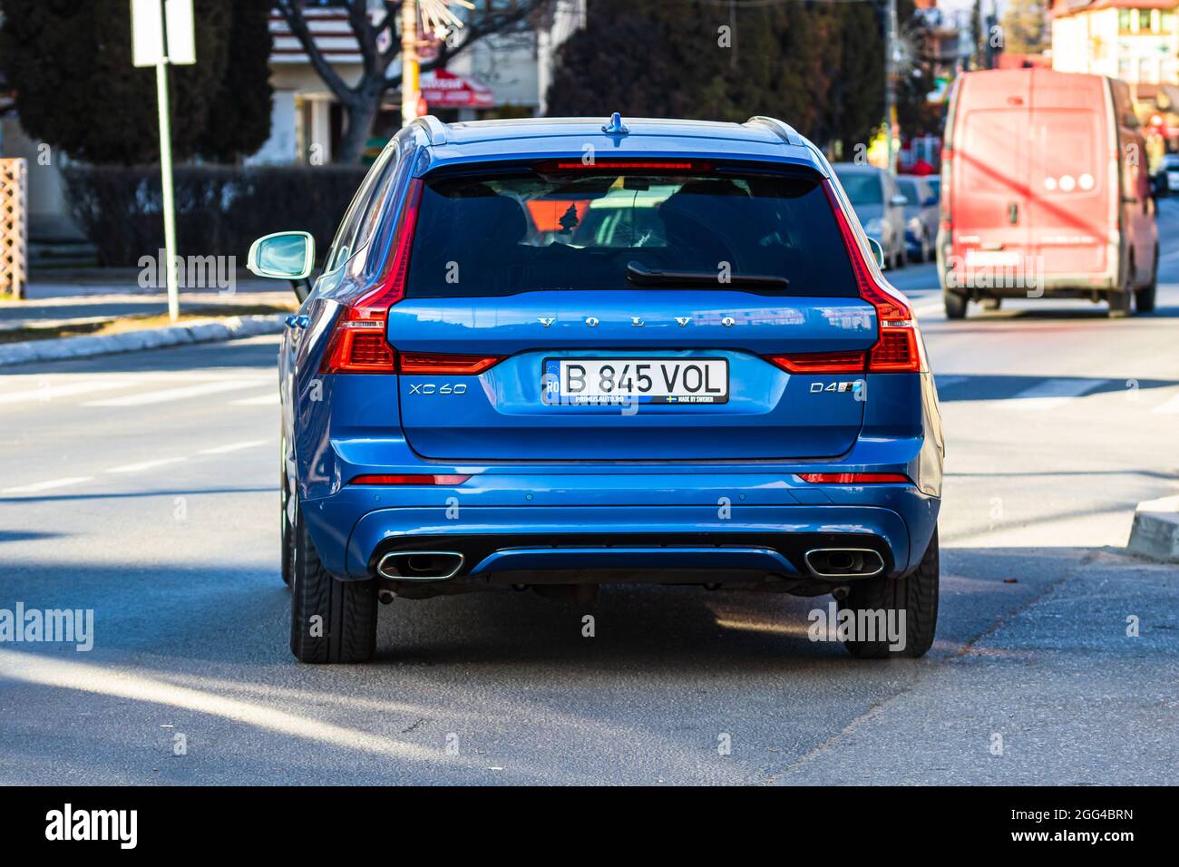 Back view of a blue luxury family car Volvo XC60 on a street in ...