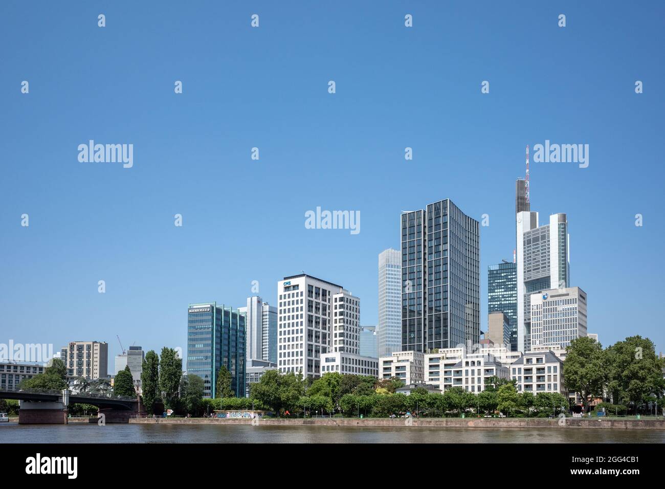 Outdoor sunny view of cityscape and promenade of riverside Main river ...