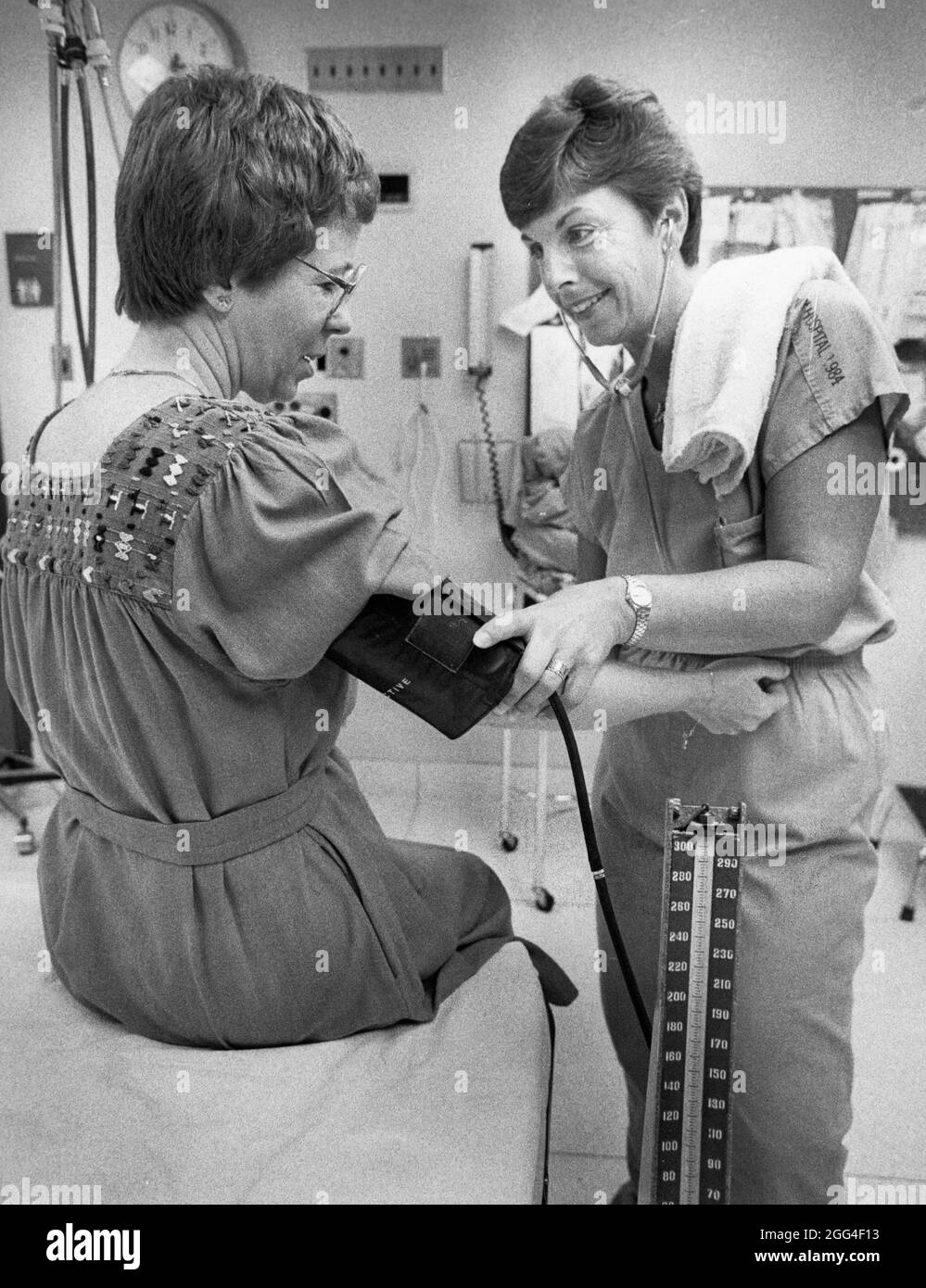 Austin Texas USA, circa 1991: Female nurse takes blood pressure of a ...