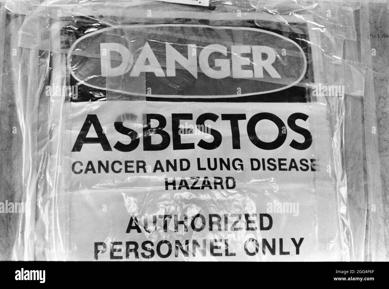 Austin Texas USA, circa 1991: Environmental Hazards: Asbestos signs on ...