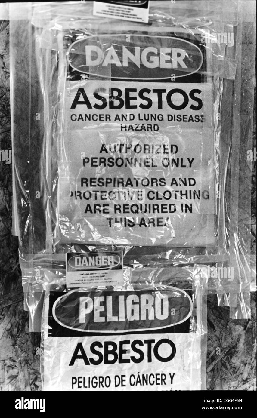 Austin Texas USA, circa 1991: Environmental Hazards: Asbestos signs on ...