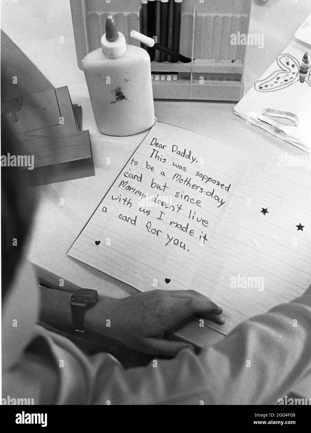 Austin Texas USA, circa 1991: Boy writing Mother's Day card to his ...