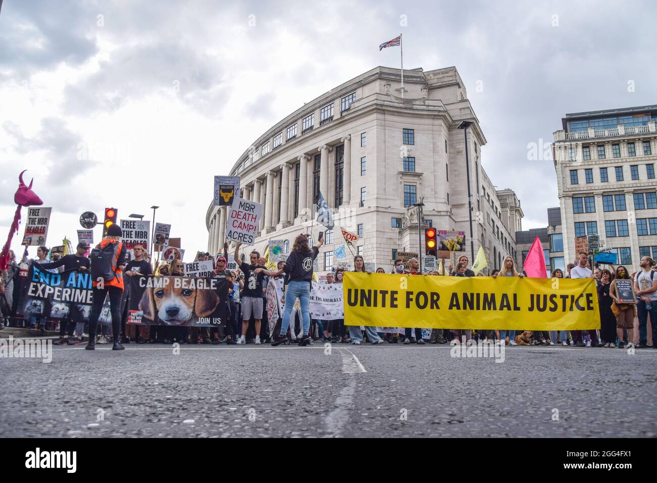Protesters march with banners and placards outside the Unilever ...