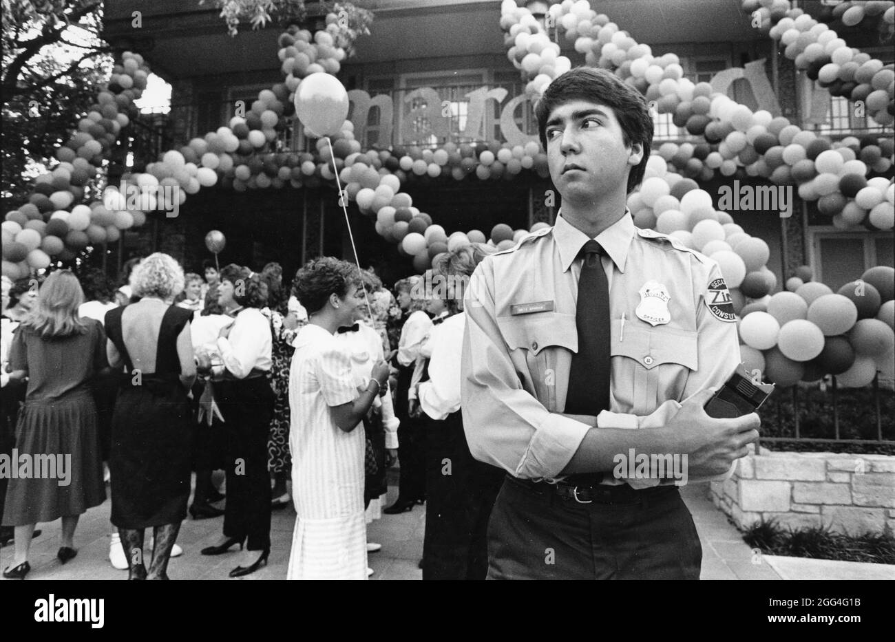Austin Texas USA, circa 1992: Young male private security guard watches ...