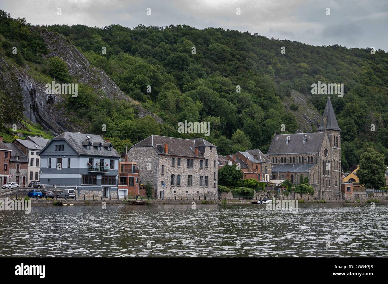 Dinant, Wallonia, Belgium - August 8, 2021: Houses and church of Saint Paul des Rivages along ...