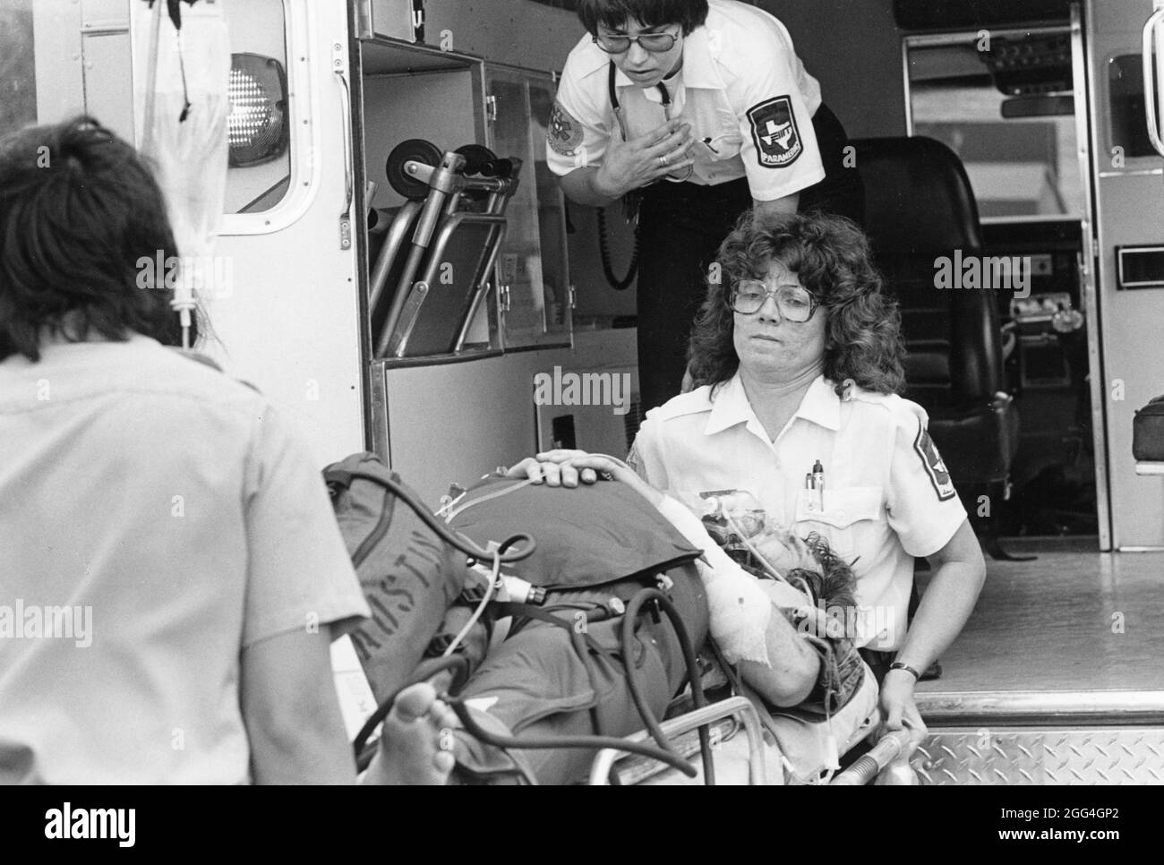 Austin Texas USA,1985: Female paramedic helps load trauma victim into ...