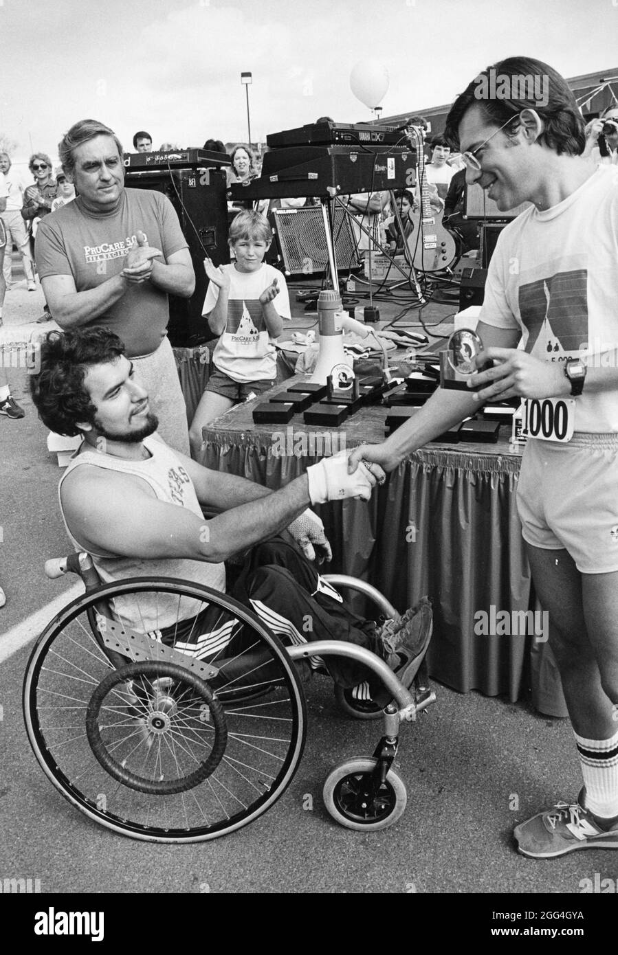 © 1989 Wheelchair athlete gets congratulations for finishing a 5,000 ...