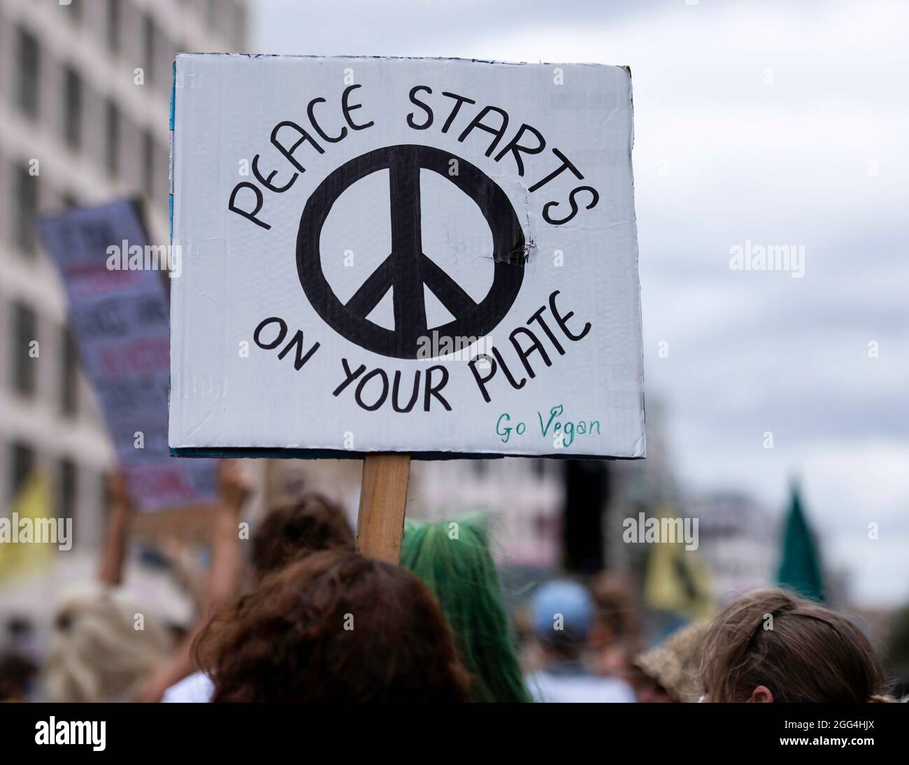 An activist march with a placard saying "Peace starts on your plate" at ...