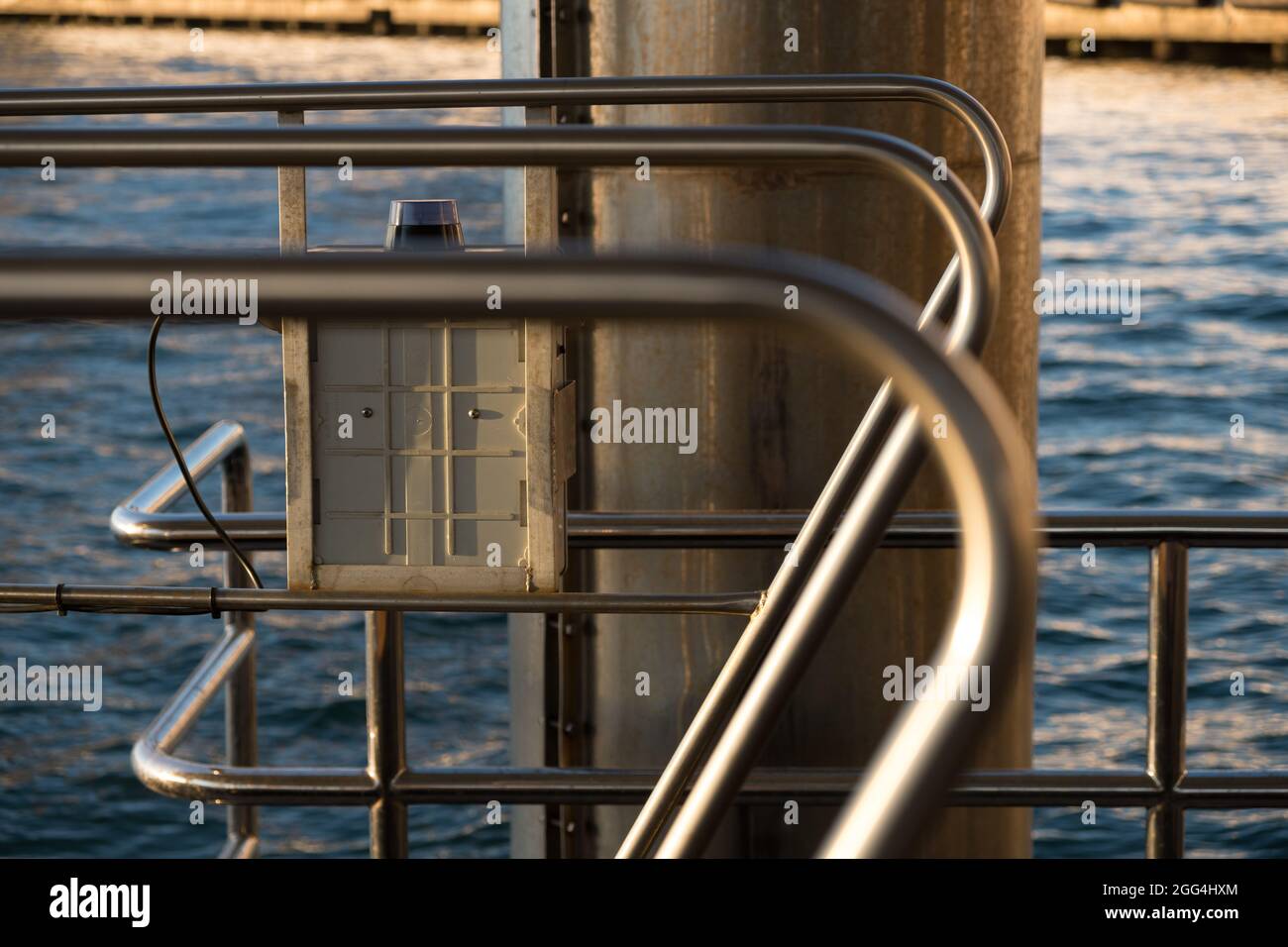Curved steel passenger railing at the ferry wharf, Sydney Stock Photo ...