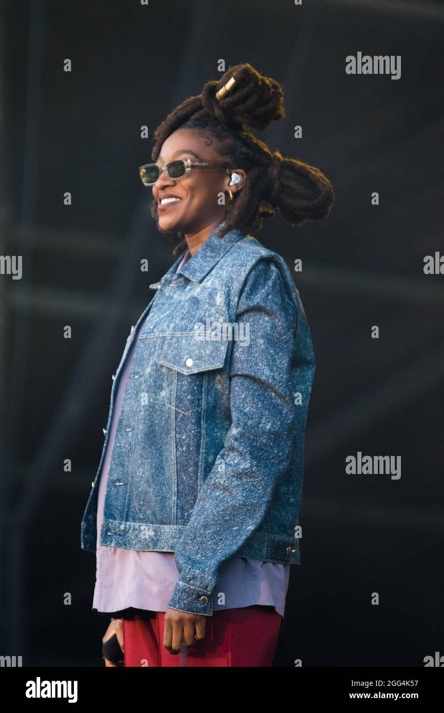 Woman in black jacket points hi-res stock photography and images - Alamy