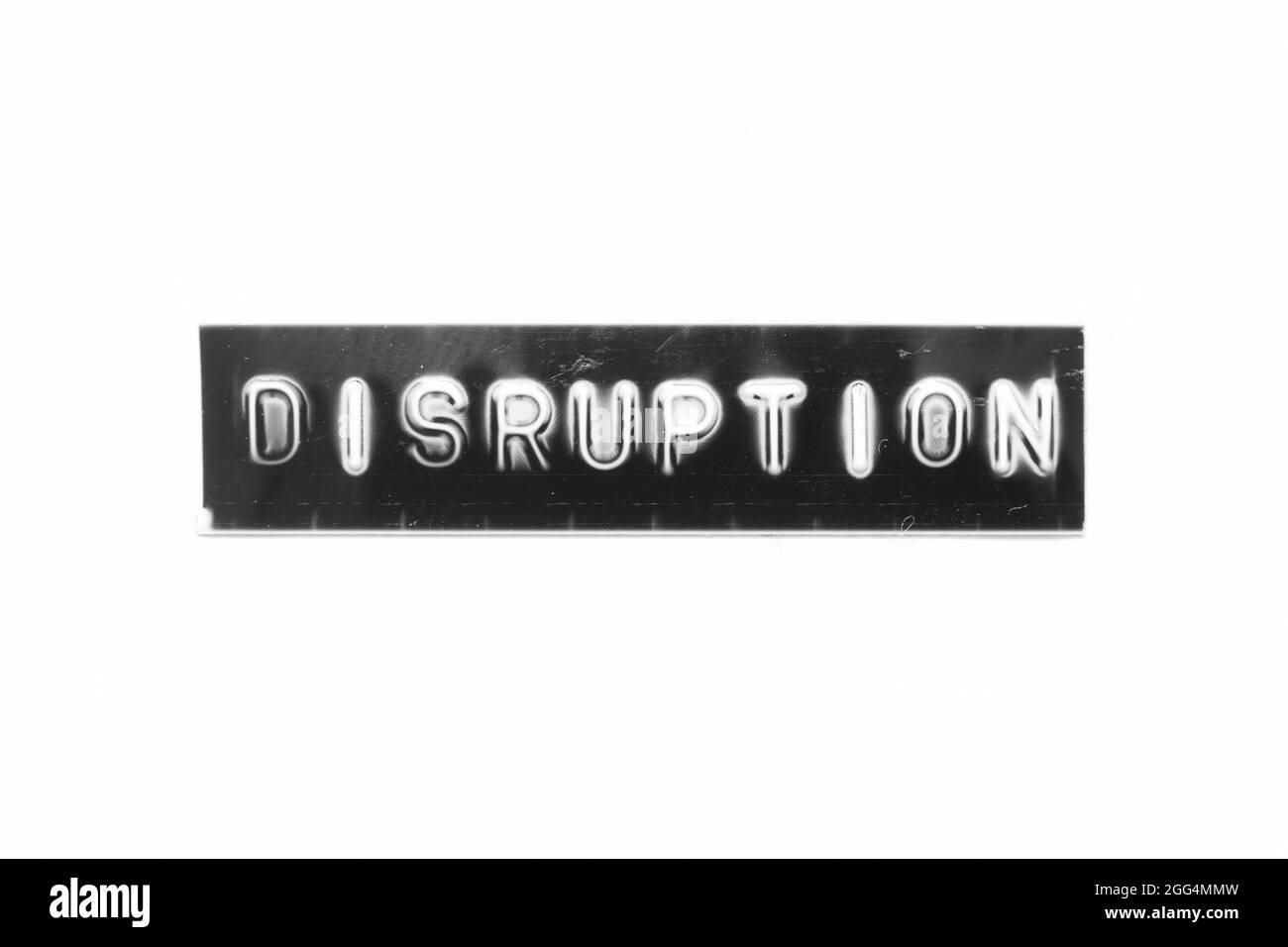 Embossed letter with word diruption in black banner on white paper ...