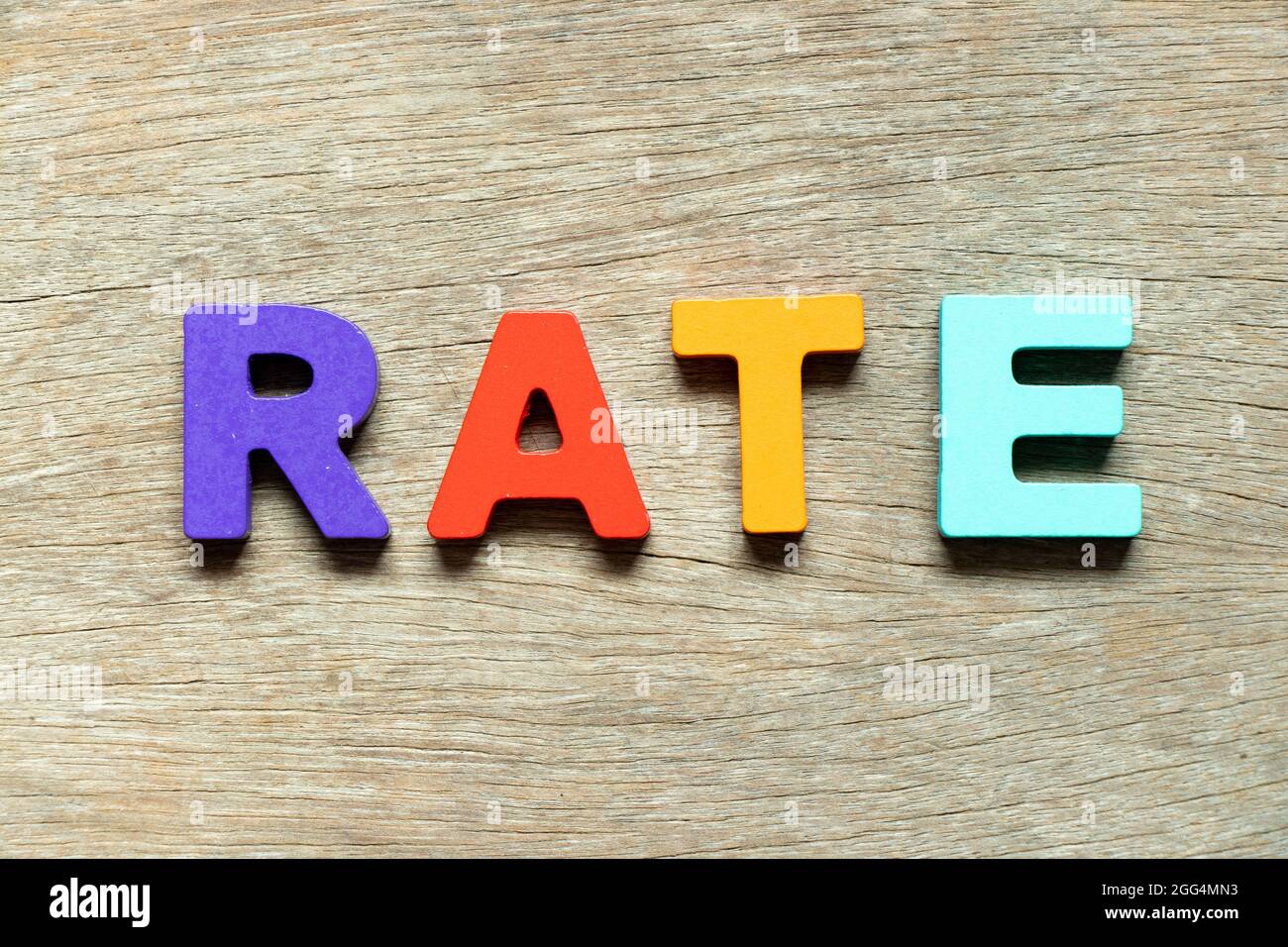 Color alphabet letter in word rate on wood background Stock Photo - Alamy