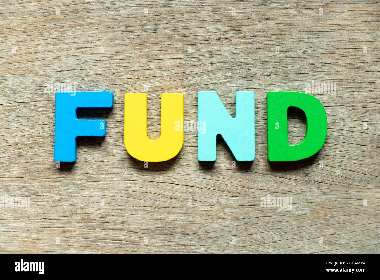 Color alphabet letter in word fund on wood background Stock Photo - Alamy