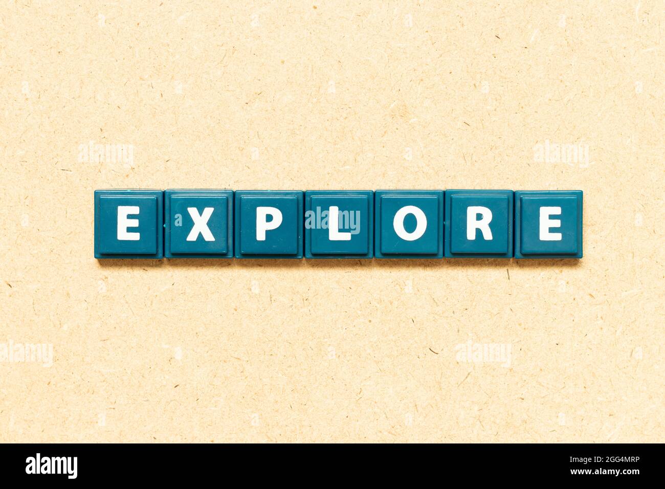 Tile alphabet letter in word explore on wood background Stock Photo - Alamy