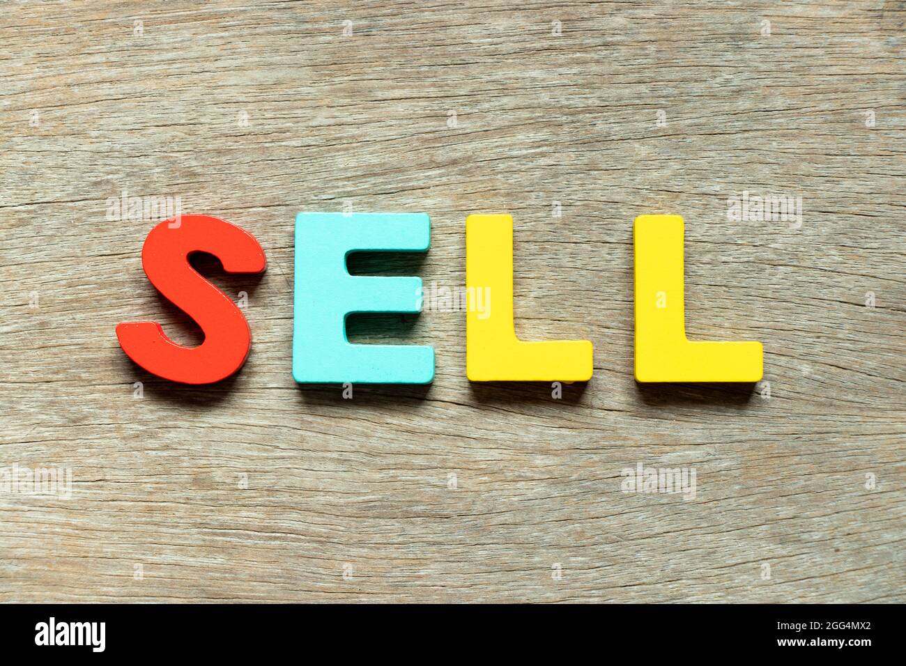 Color alphabet letter in word sell on wood background Stock Photo - Alamy