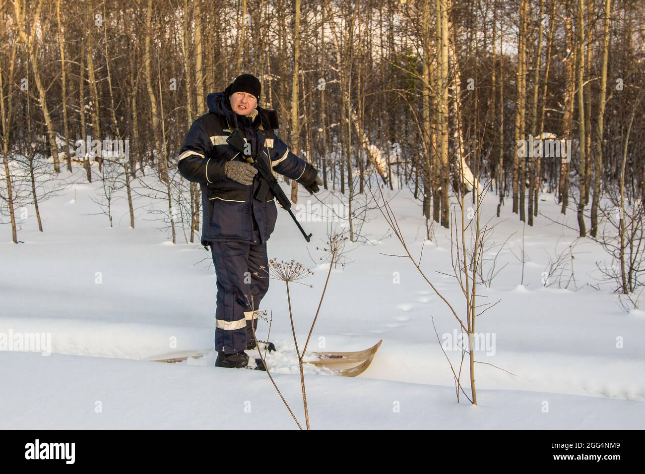forest, Russia, january 30 2019, the hunter points to the tracks ...