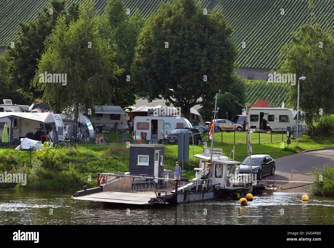 Nordheim, Germany. 11th Aug, 2021. Pedestrians and car drivers board ...