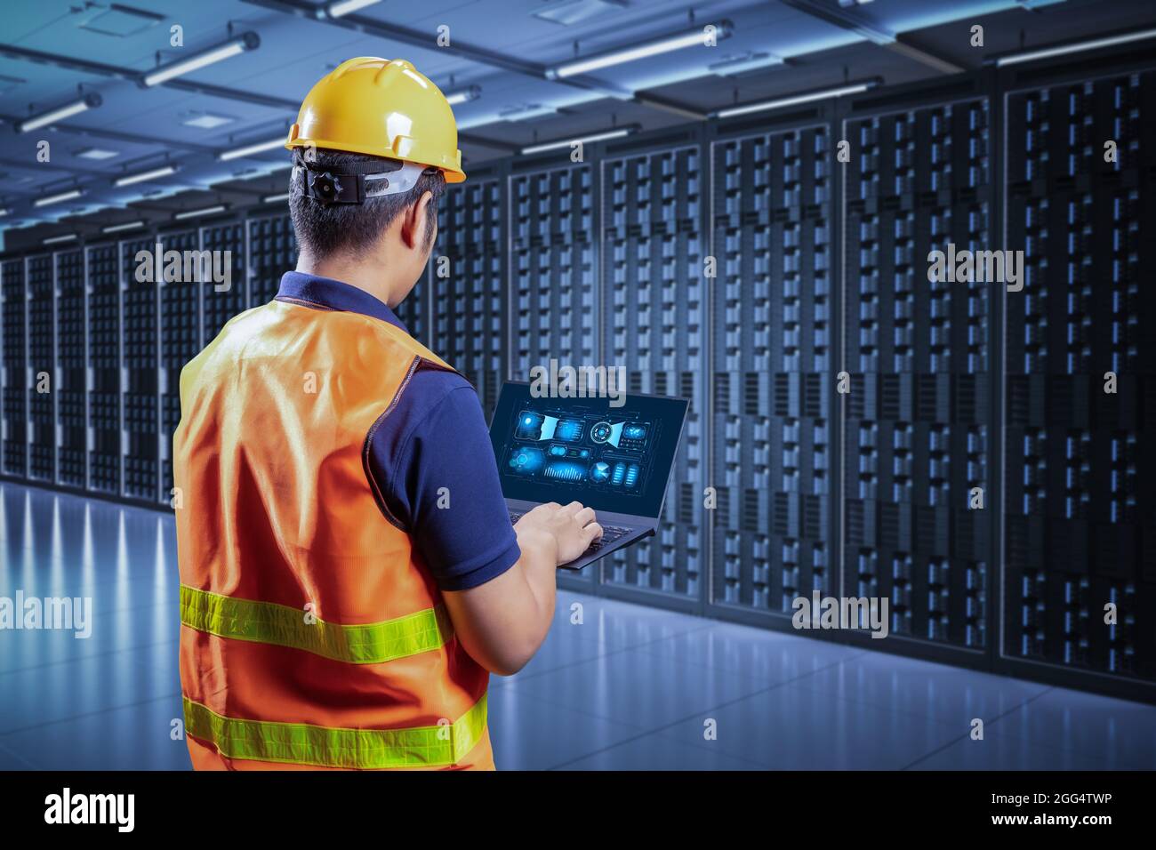Programmer or engineer with computer notebook in server room Stock ...