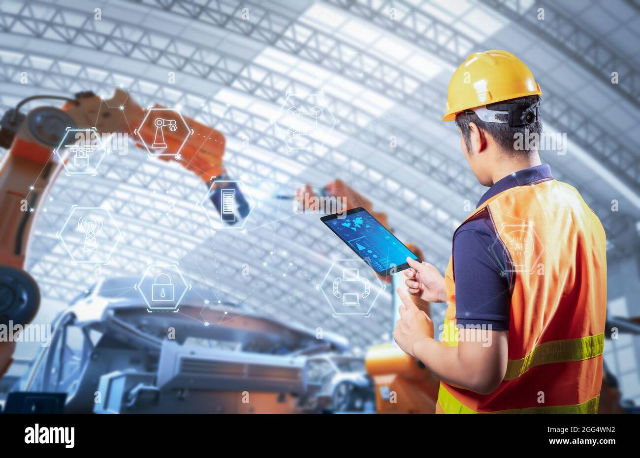 Technician or engineer work with 3d rendering robot in factory Stock ...