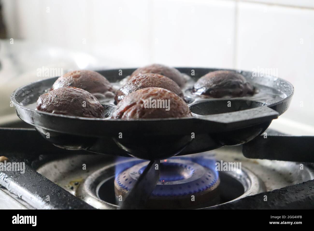 Making of unni appam using unni appam pan. Unni appam or Rice fritters ...