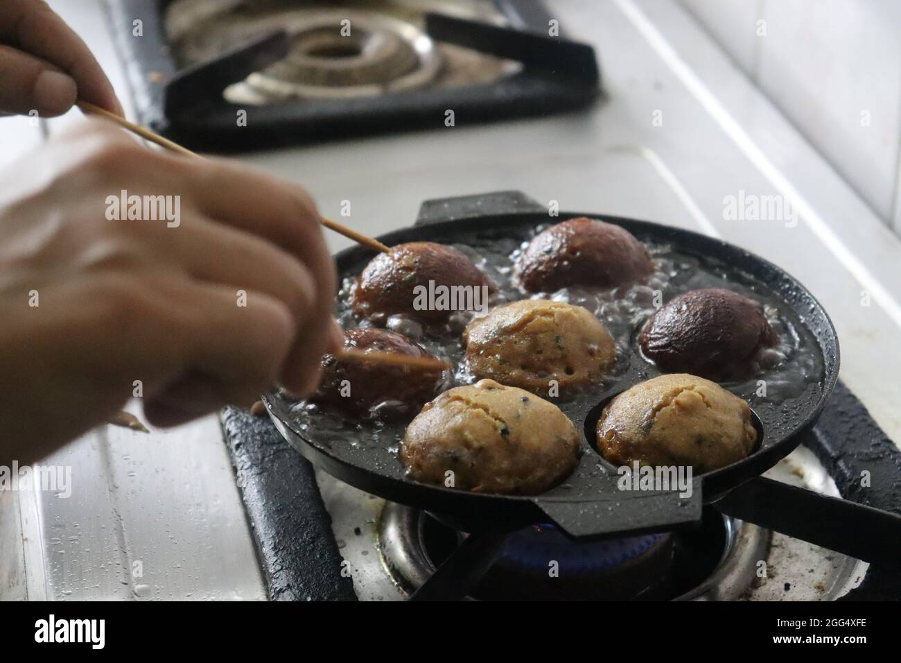 Making of unni appam using unni appam pan. Unni appam or Rice fritters ...