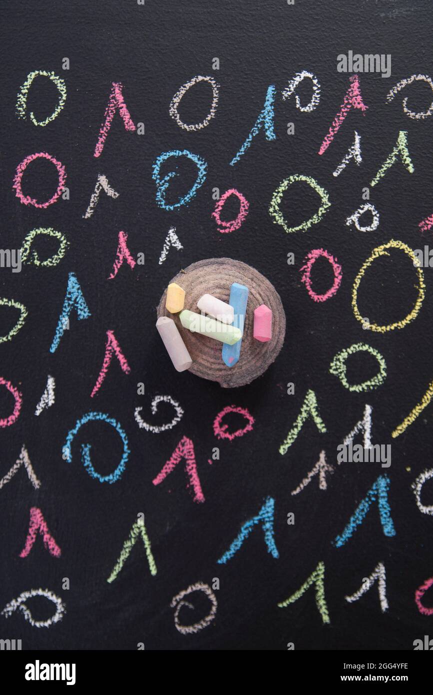 Graphic representation with chalk on blackboard colorful binary code ...