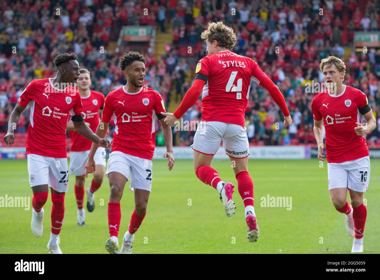 Callum Styles #4 of Barnsley celebrates his goal with his team mates ...