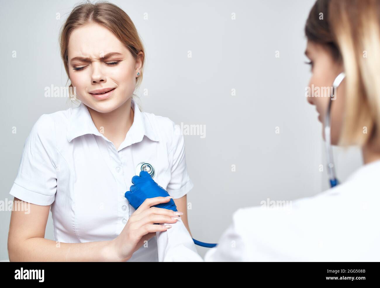 nurse stethoscope healing procedures light background Stock Photo - Alamy