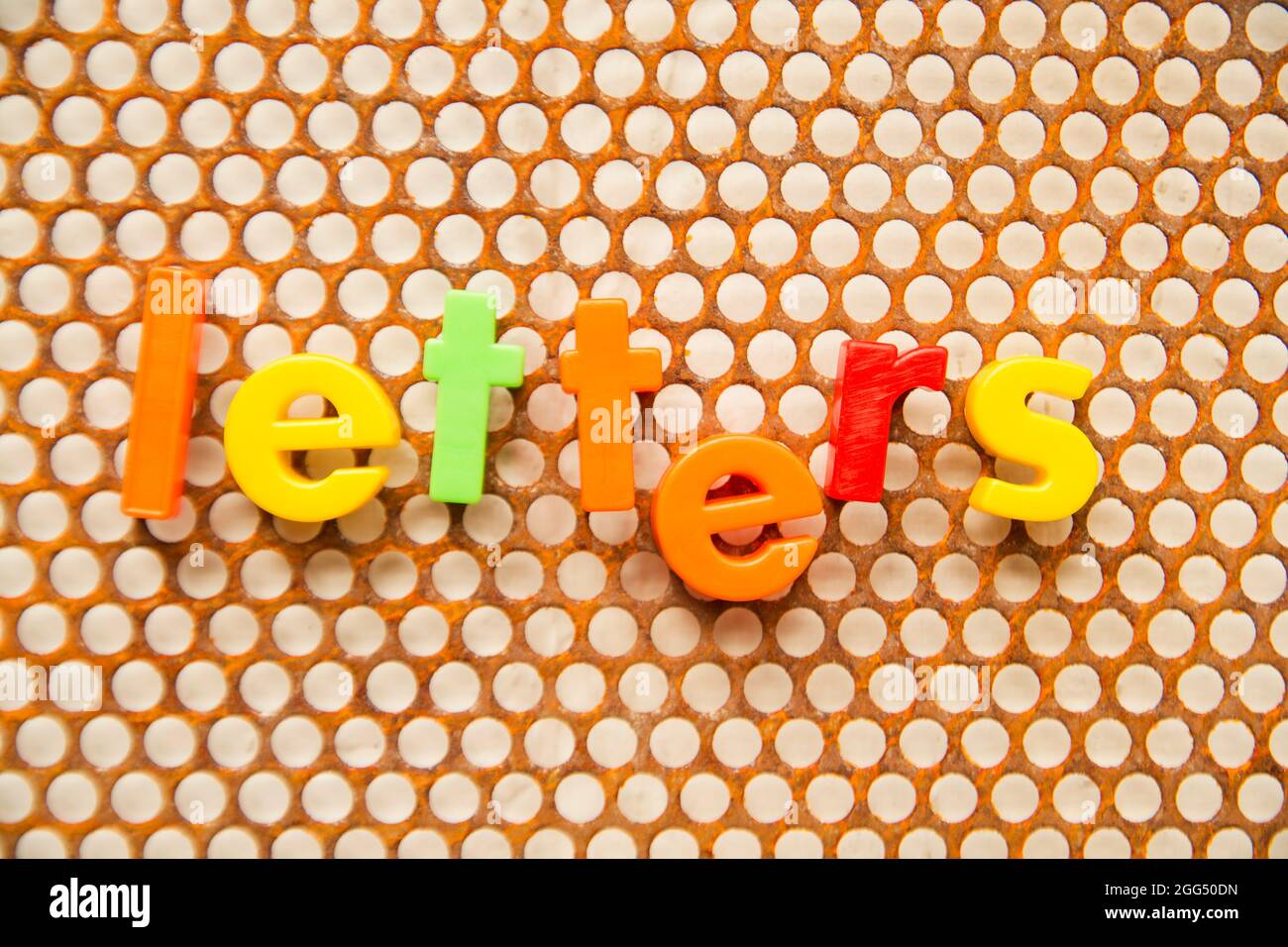 Series of letters and numbers on white base metal Stock Photo - Alamy