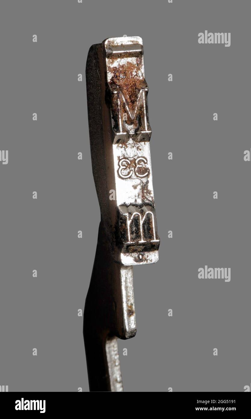 Macro of a old typywriter hammer Letter M Stock Photo - Alamy