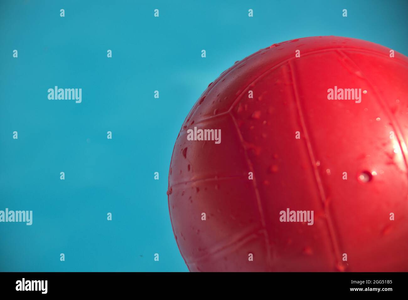 red ball floating in a pool Stock Photo - Alamy