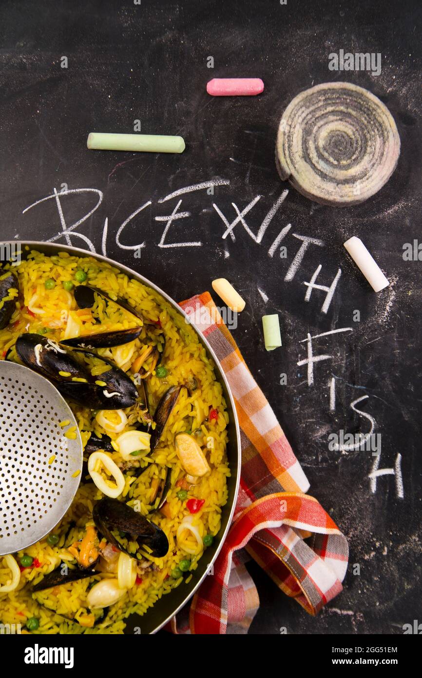 Spanish dish made of rice and fish with various vegetables Stock Photo ...