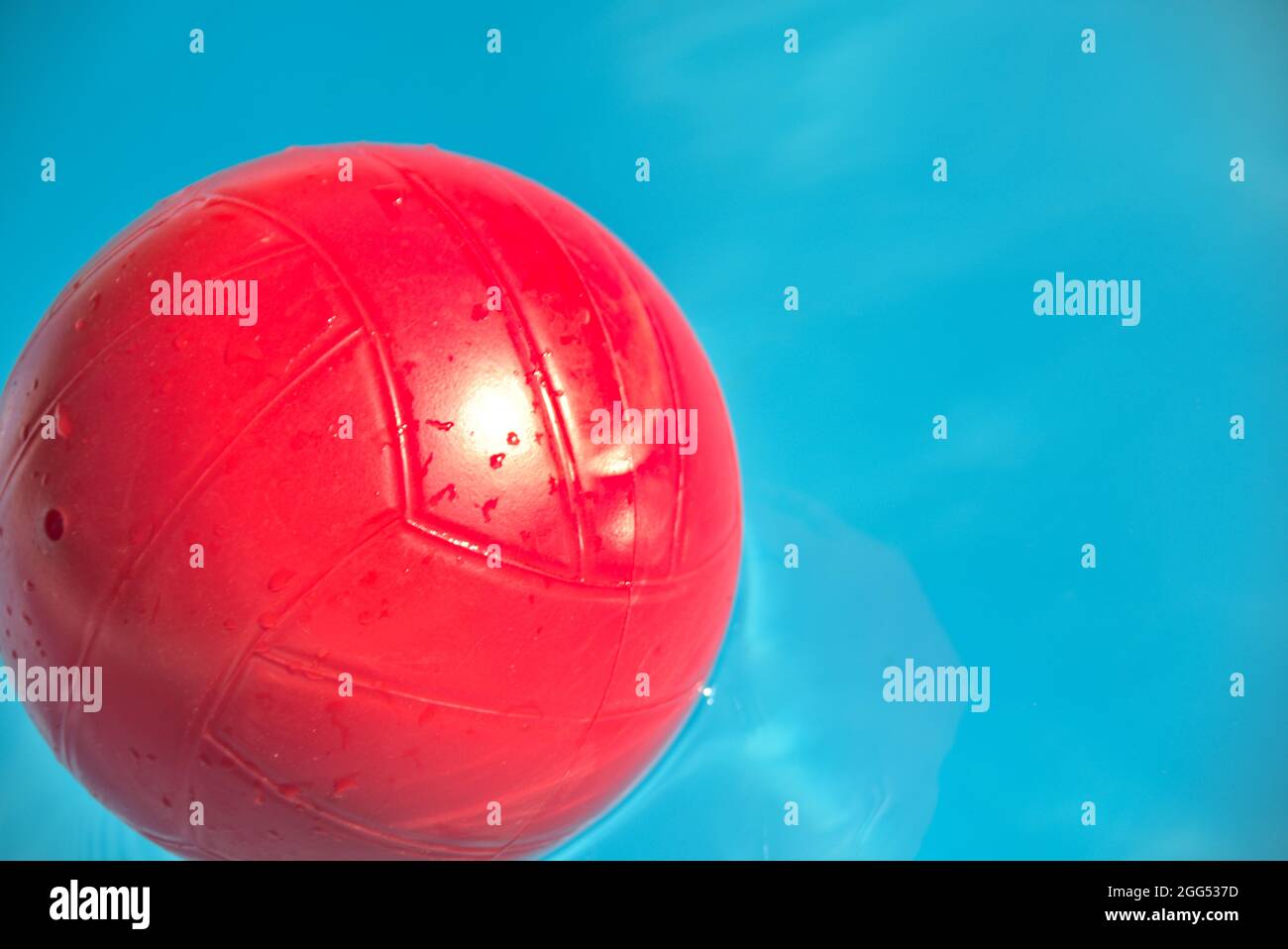 red ball floating in a pool Stock Photo - Alamy