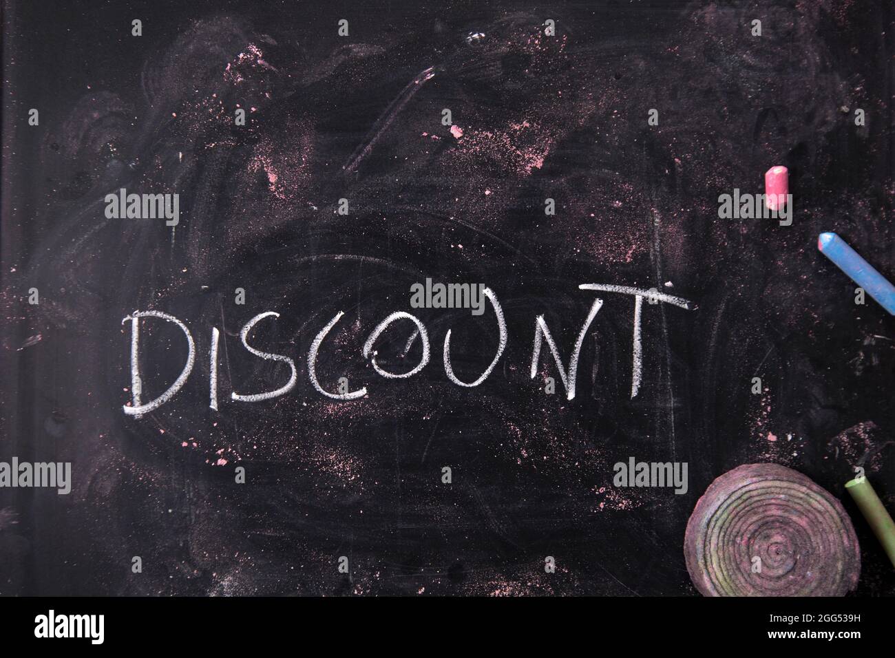 Representation of the word, discounts, written with chalk on blackboard ...