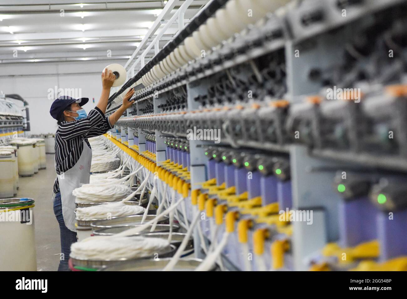 Urumqi. 24th Aug, 2020. File photo shows a worker busy working in a ...