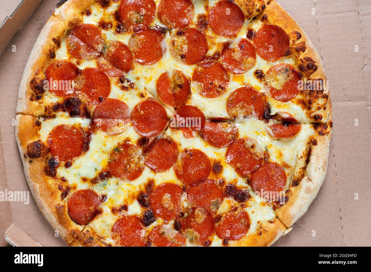 Tasty paperoni pizza in a box. Top view on paperoni pizza. Concept for ...