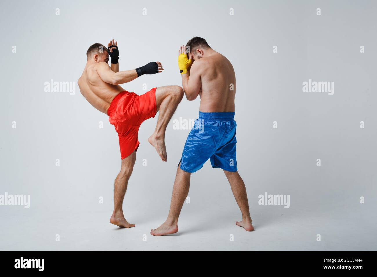 Two men boxers fighting muay thai boxing white background Stock Photo ...