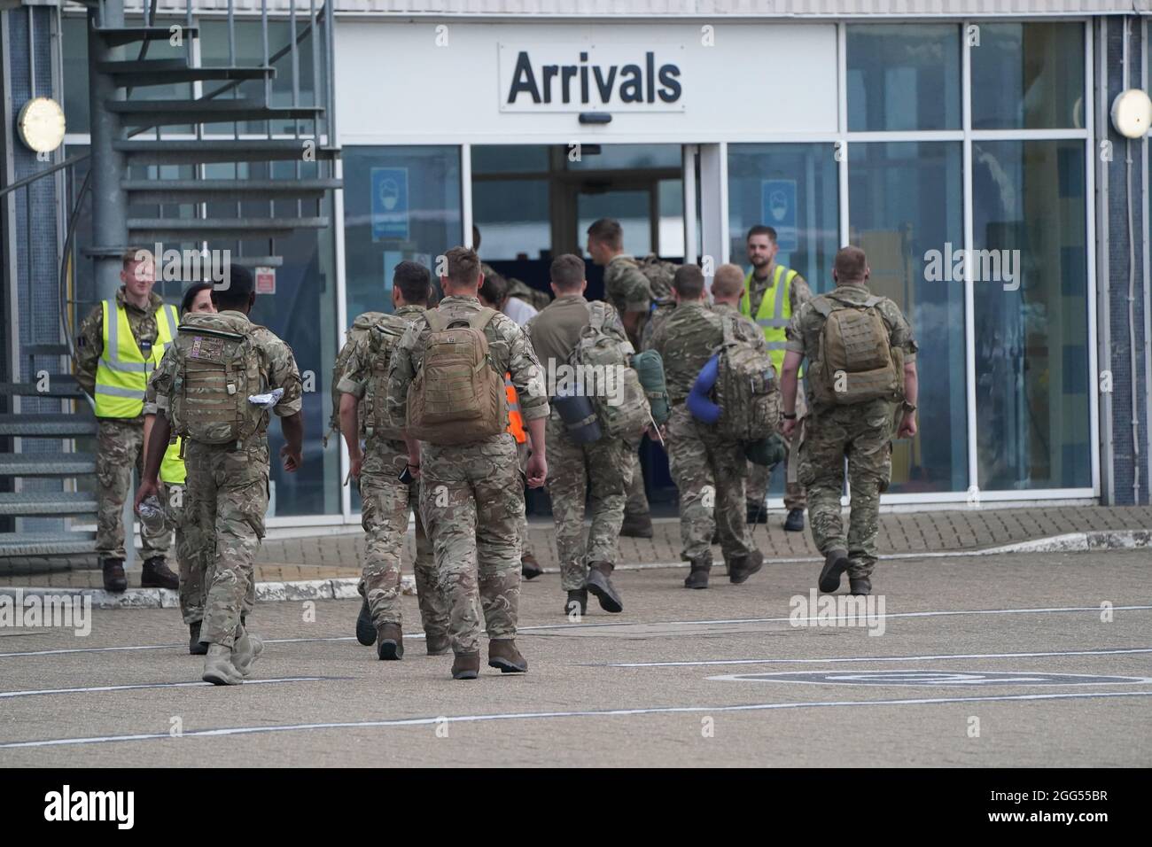 Members of the British armed forces 16 Air Assault Brigade walk to the ...