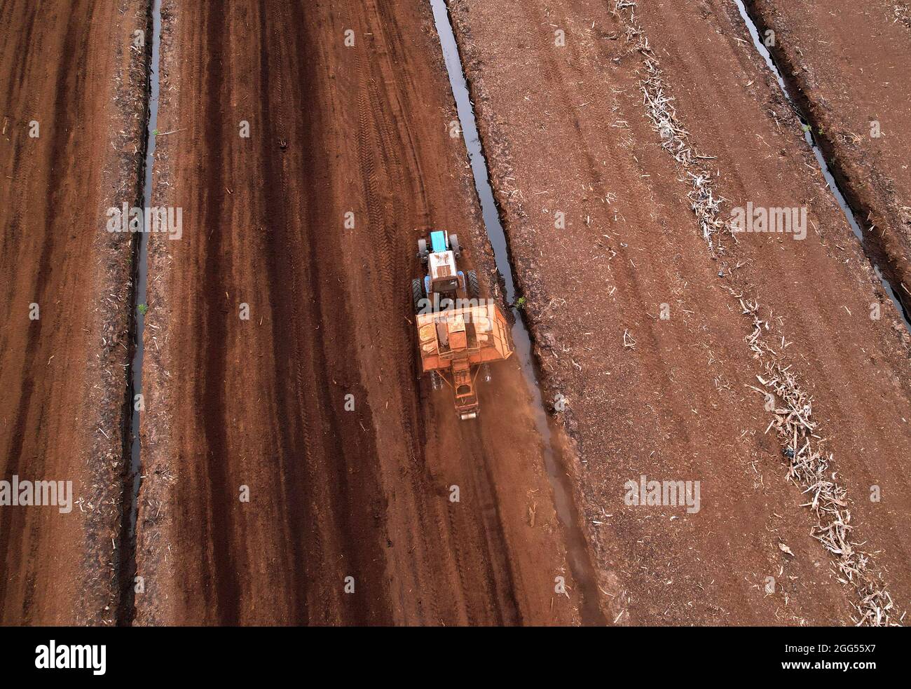 Peat Harvester Tractor on Collecting Extracting Peat. Mining and ...