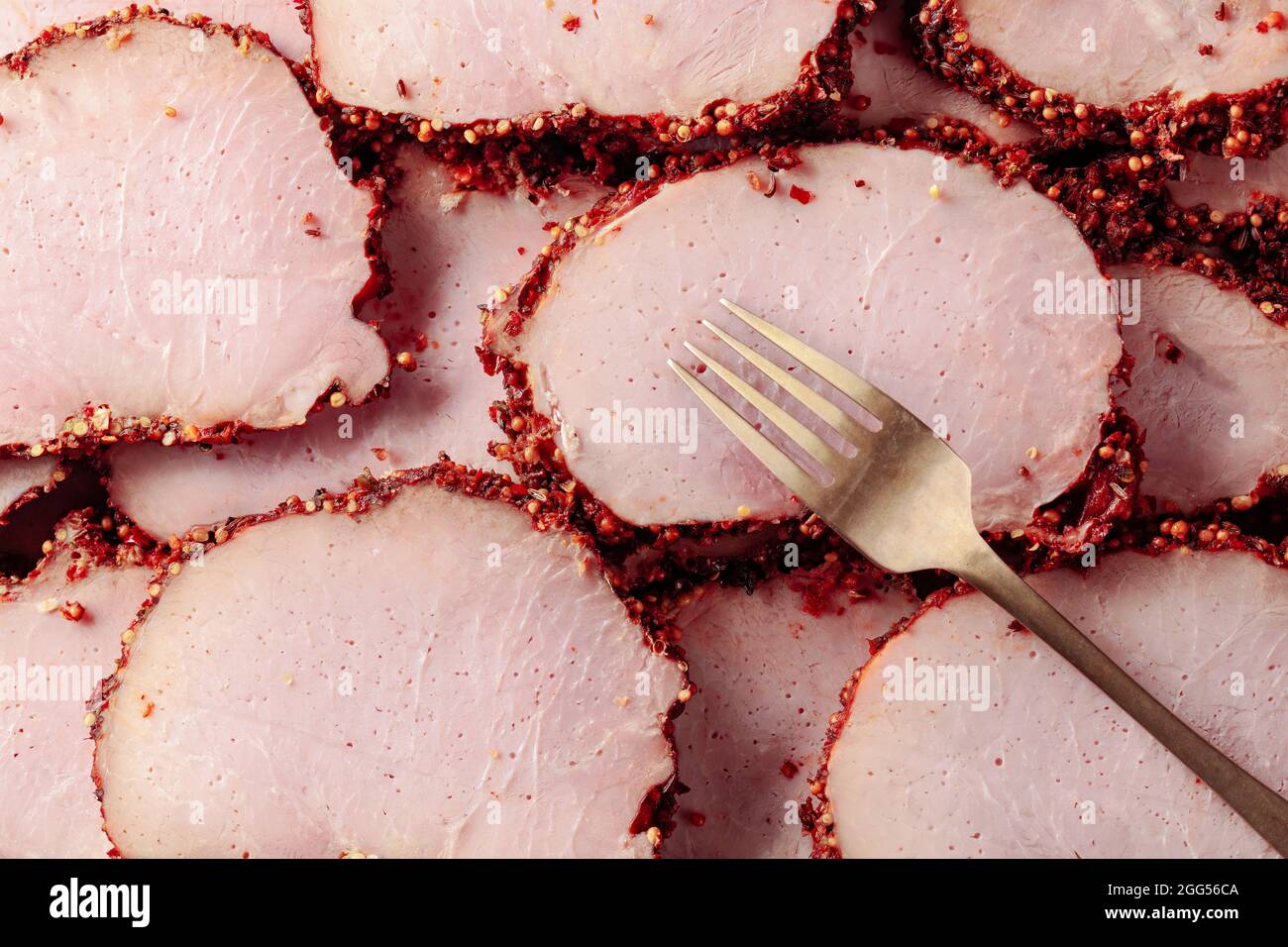 Slices of spicy smoked ham. Top view Stock Photo - Alamy