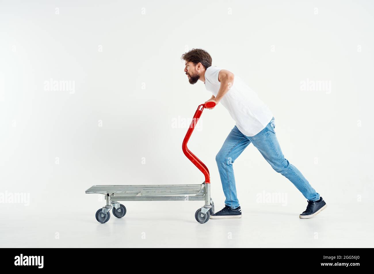 Cheerful man ride a cart entertainment shipping light background Stock ...