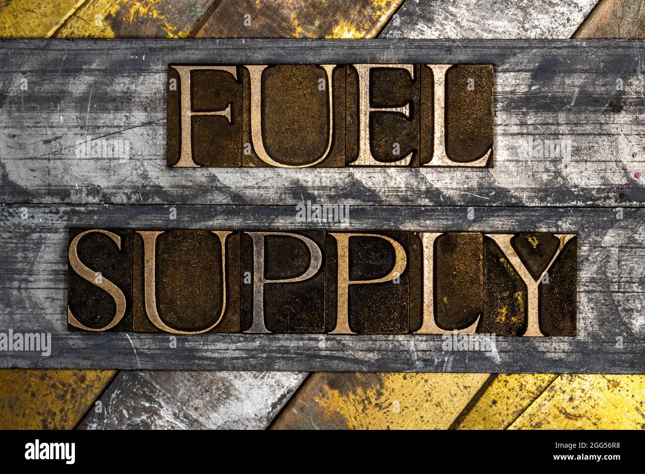 Fuel Supply text message on vintage textured grunge copper and gold ...