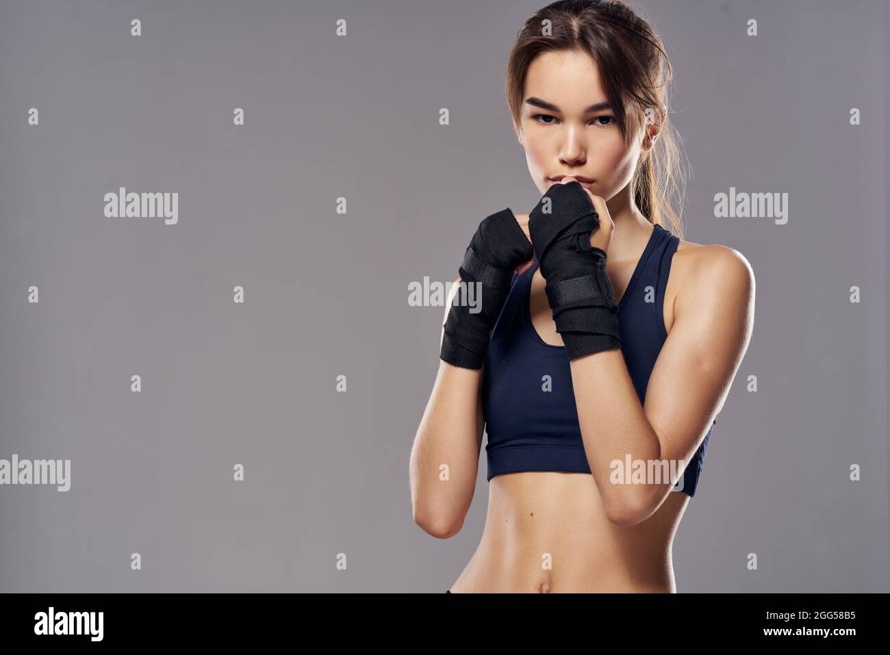 beautiful woman hand bandages punch workout fighter dark background ...
