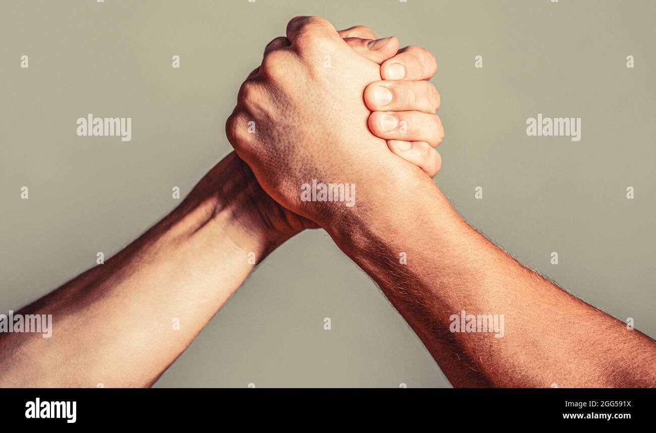 Two male friends arm wrestling hi-res stock photography and images - Alamy