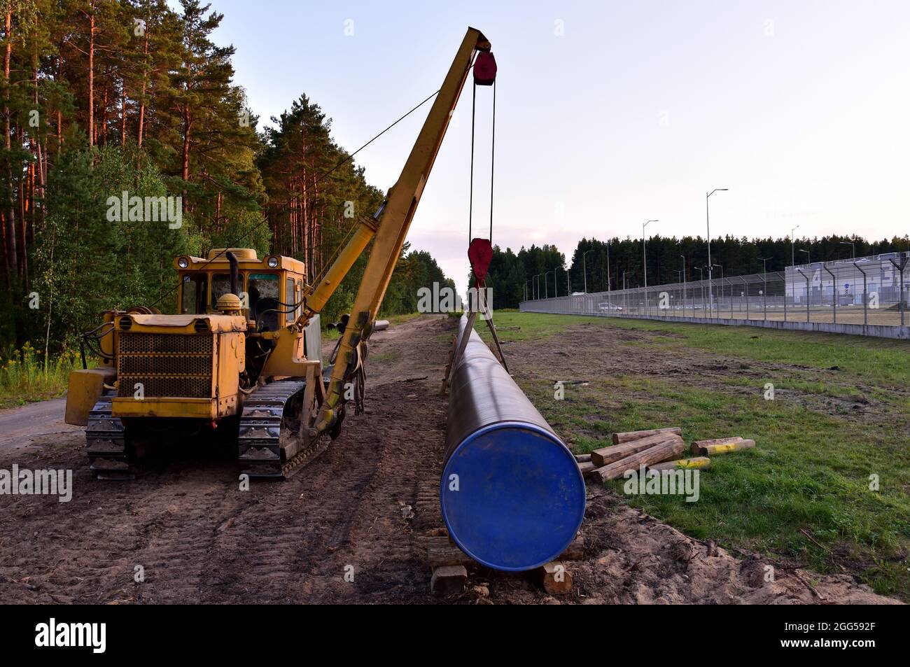 Natural Gas Pipeline Construction. Laying oil pipe in a trench in the ...
