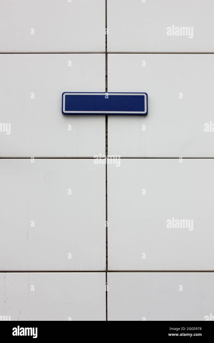Blue street sign on the modern building Stock Photo - Alamy