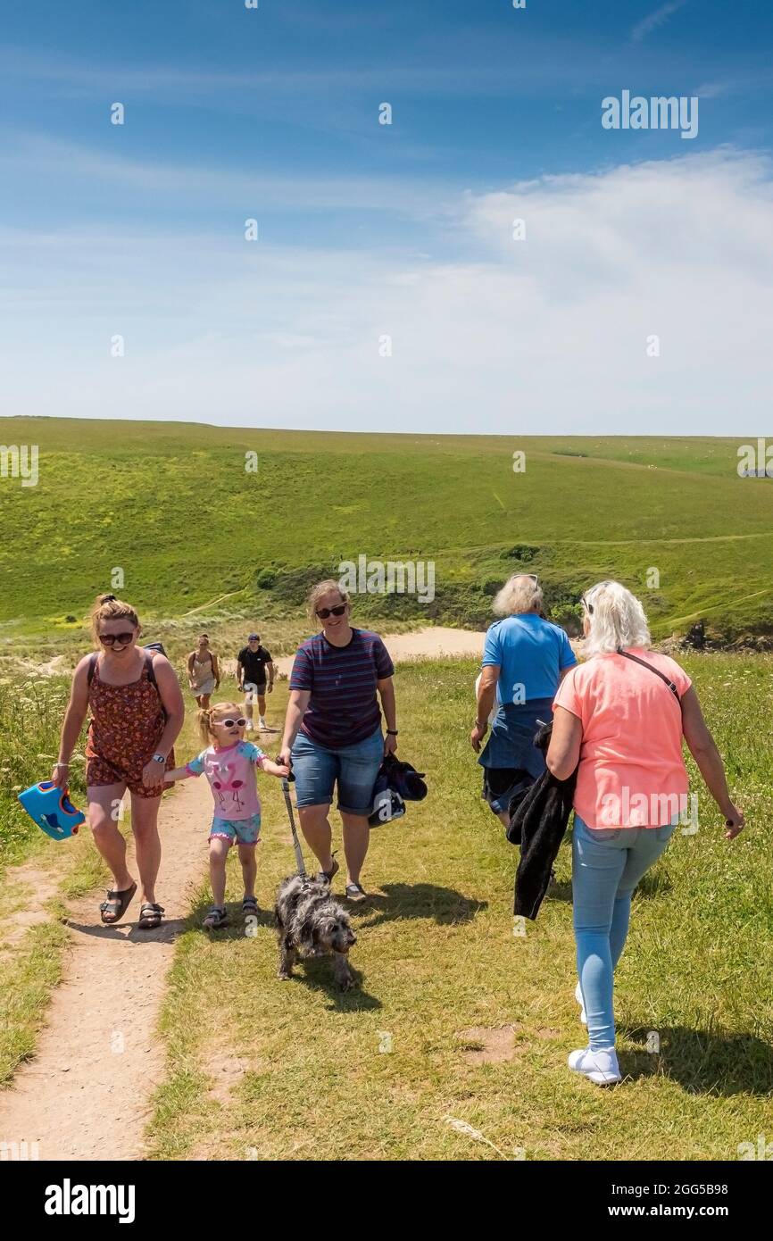 Holidaymakers walking up and walking down a track leading to the ...