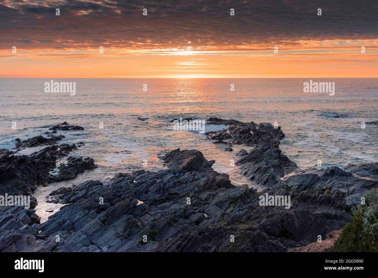 A spectacular sunset over Fistral Bay on the coast of Newquay in ...